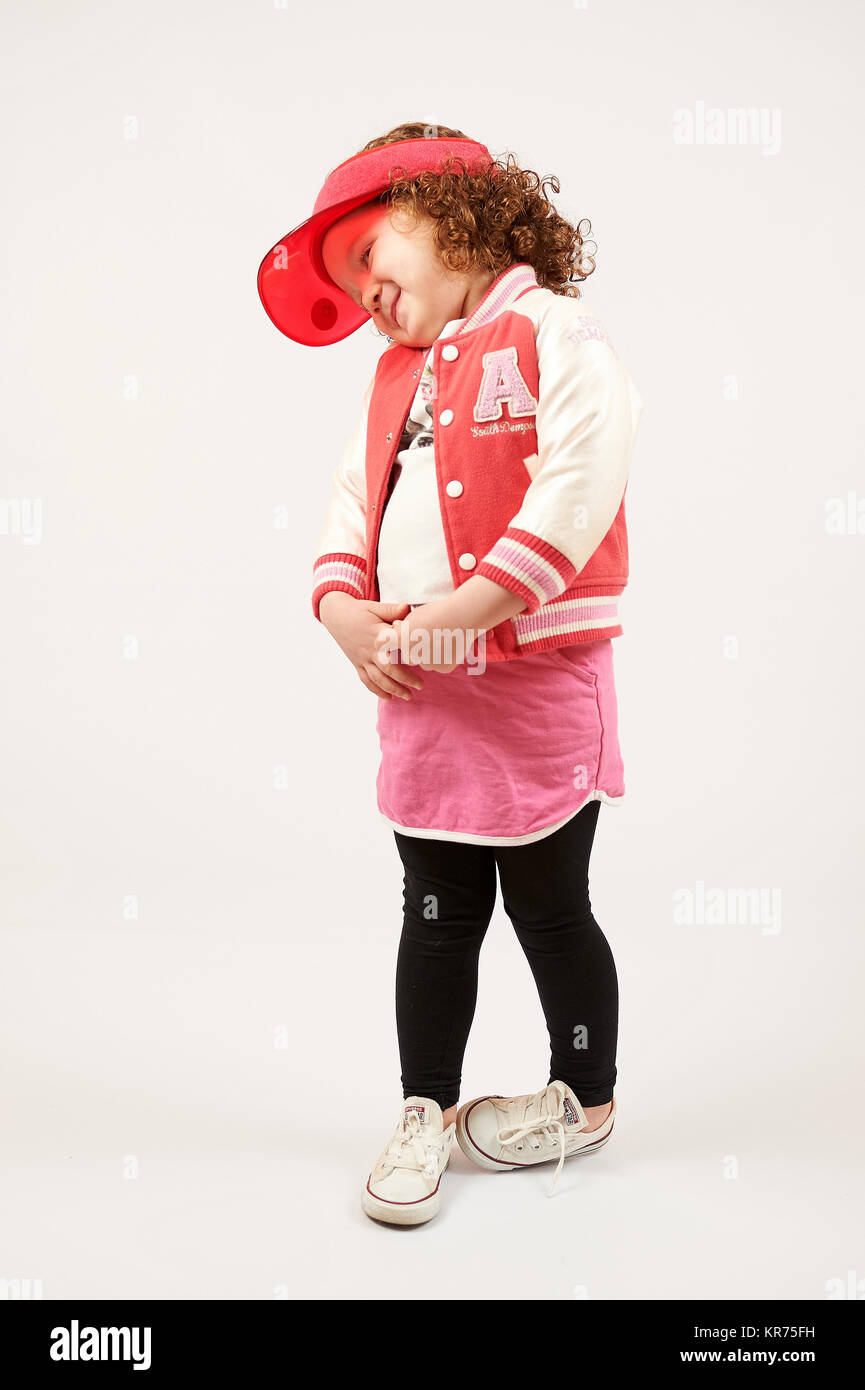 Little Girl Fashion Model With Red Cap Stock Photo - Alamy