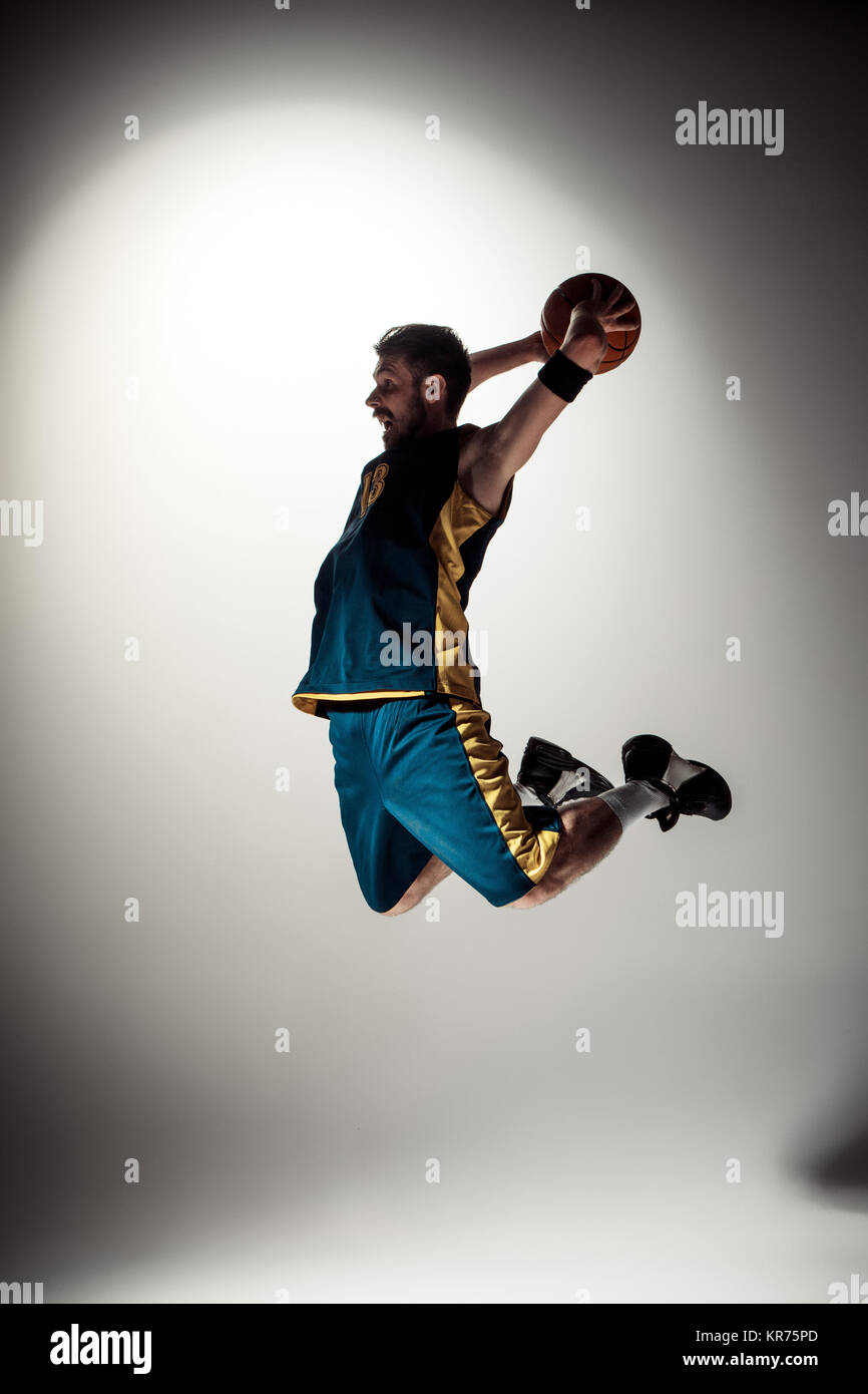 Full length portrait of a basketball player with ball Stock Photo - Alamy