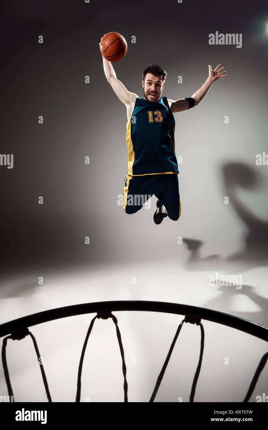 Full length portrait of a basketball player with ball Stock Photo - Alamy