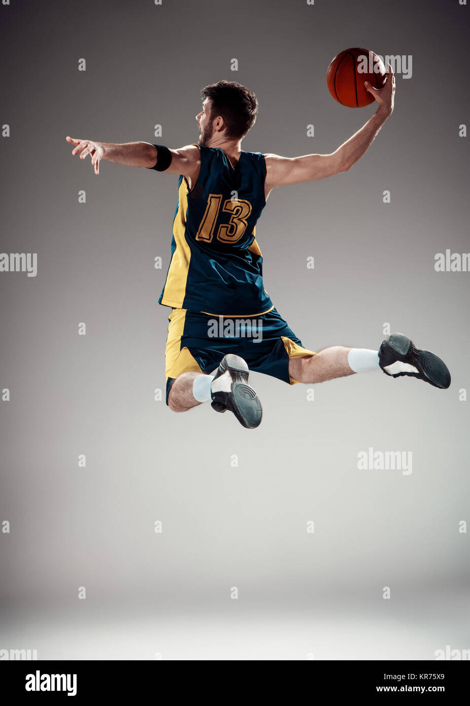 Full length portrait of a basketball player with ball Stock Photo - Alamy