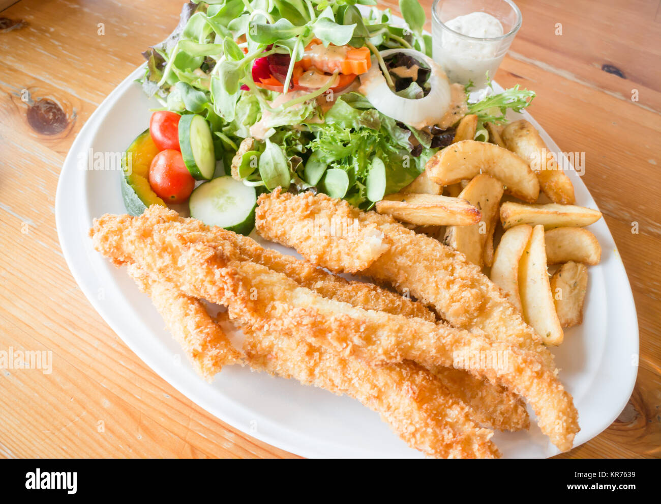 Gourmet fish and chips with salad Stock Photo - Alamy