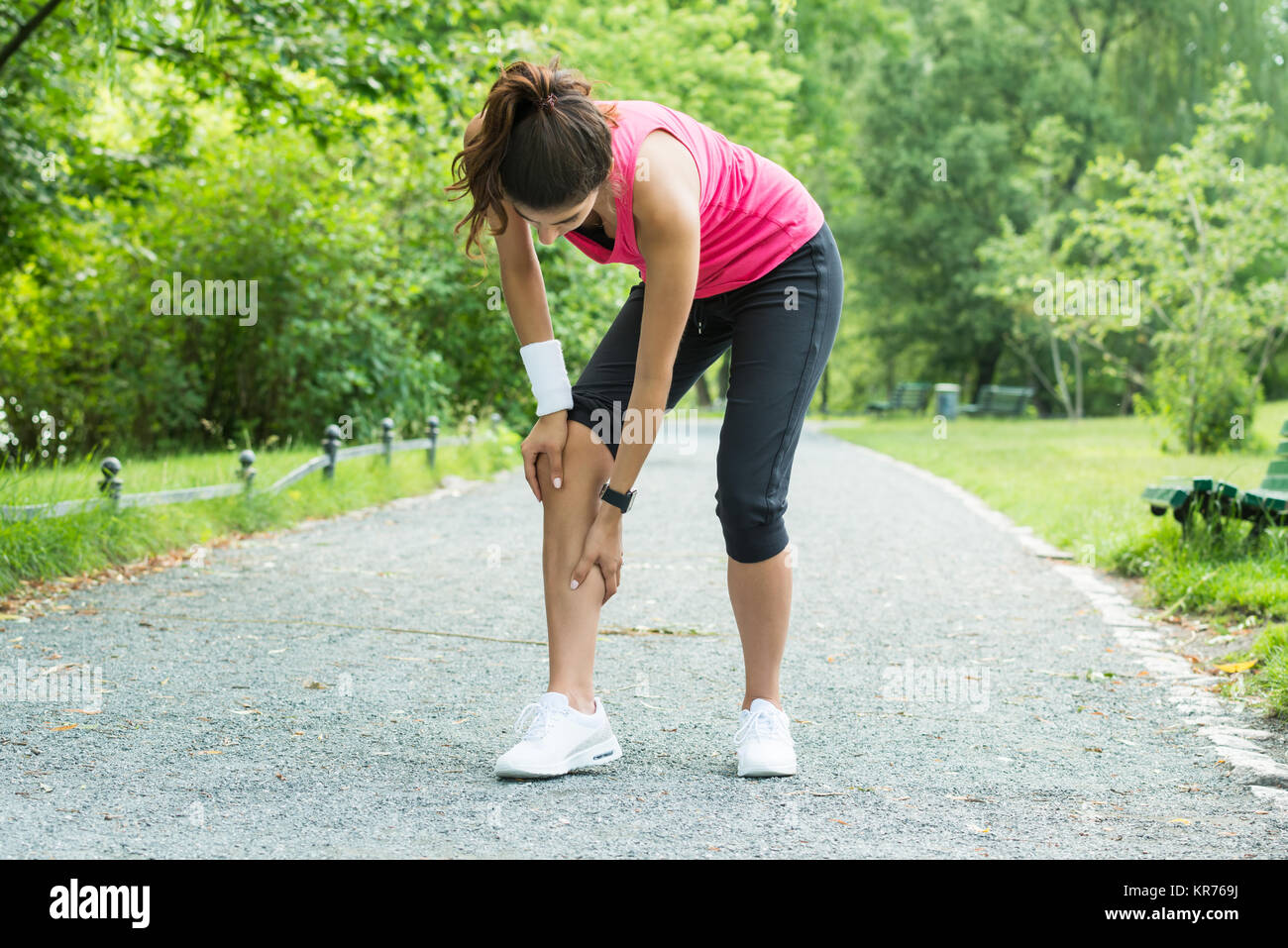 Female Jogger Having Pain In Her Leg Stock Photo - Alamy