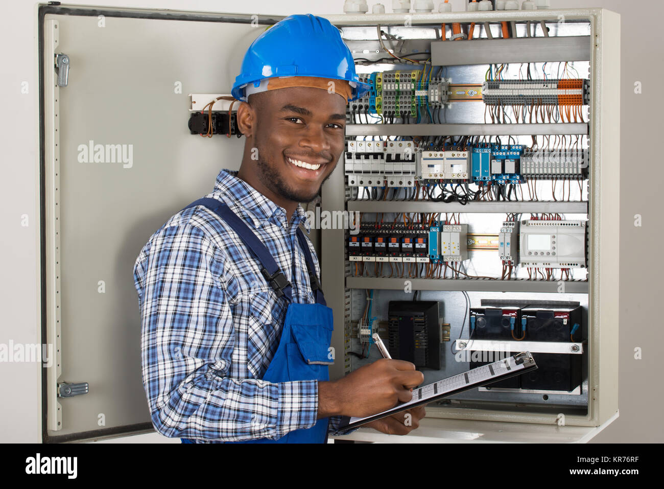 Male Technician Holding Clipboard Stock Photo - Alamy