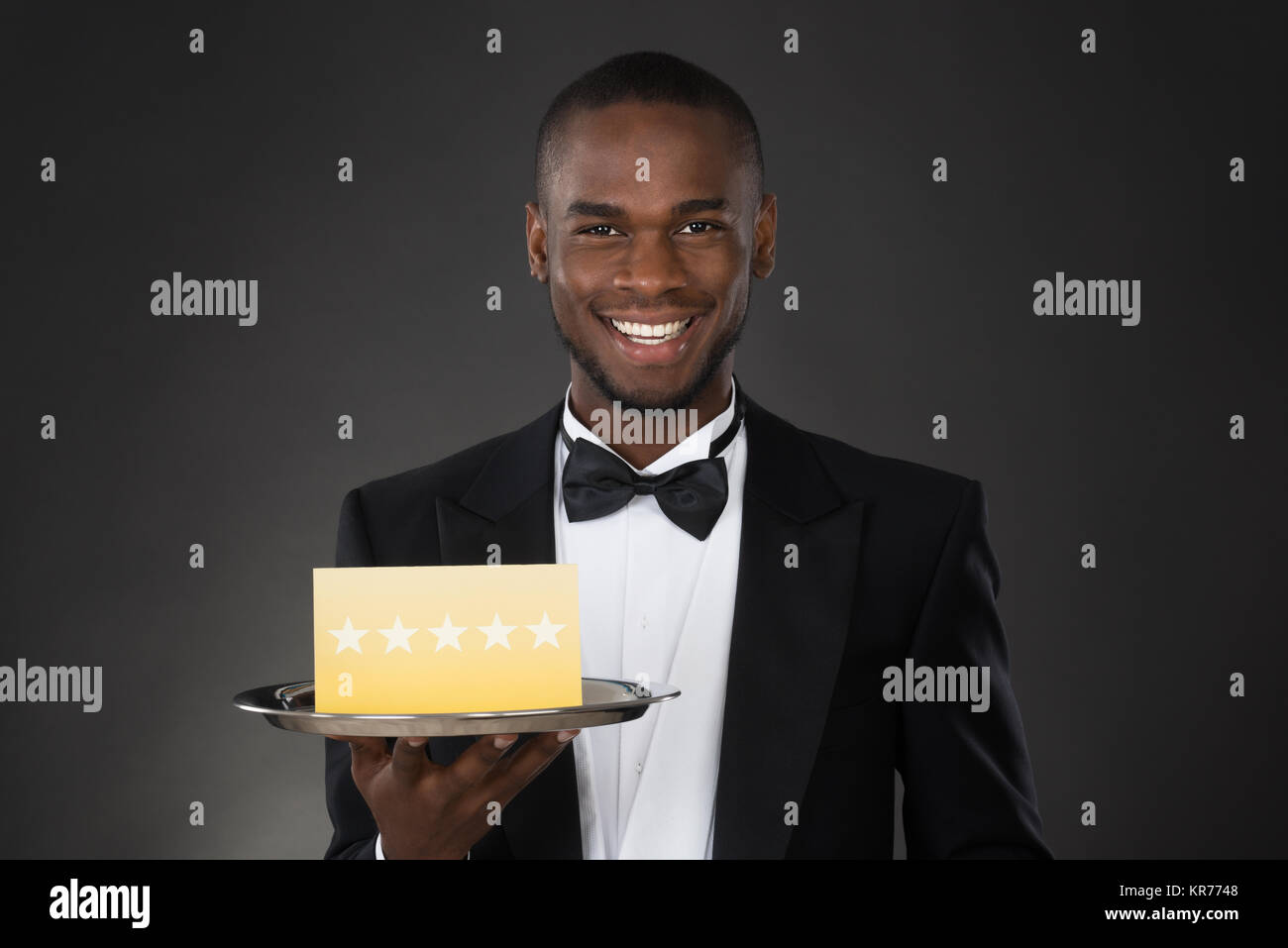 Waiter Holding Plate With Star Rating Stock Photo - Alamy
