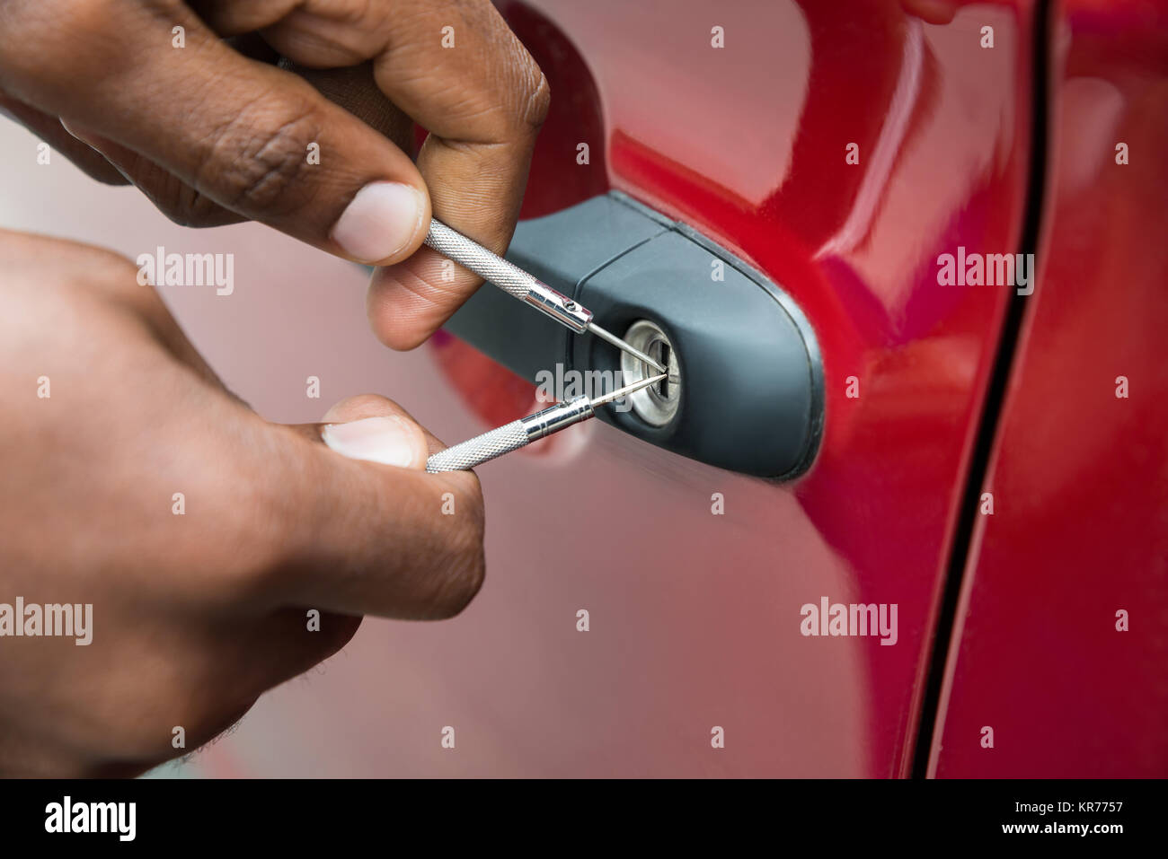 Person Hand Opening Car Door With Lockpicker Stock Photo - Alamy