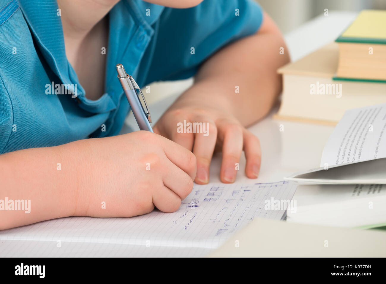 Teen boy writing book hi-res stock photography and images - Alamy