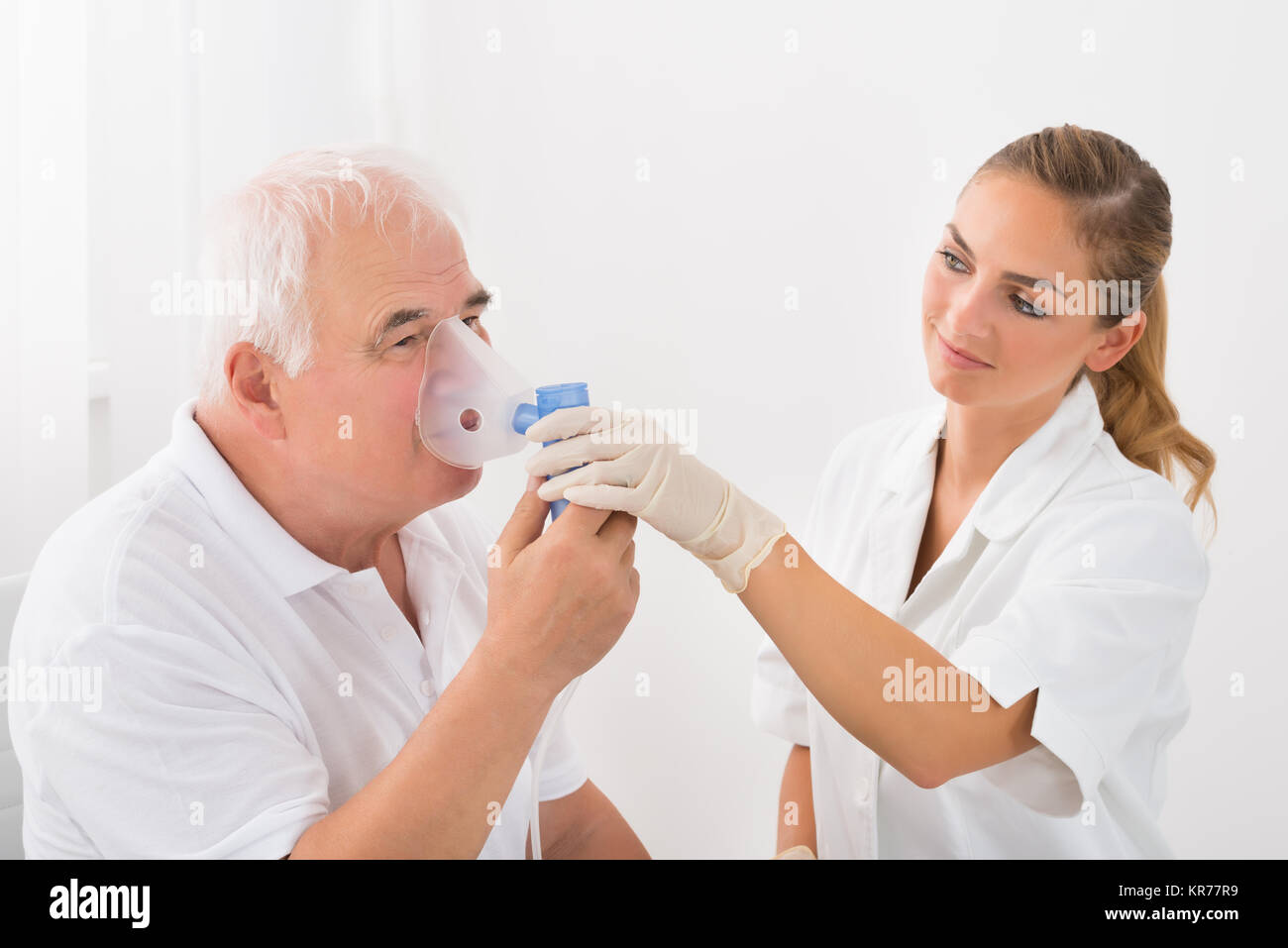 Patient Inhaling Through Oxygen Mask Stock Photo - Alamy