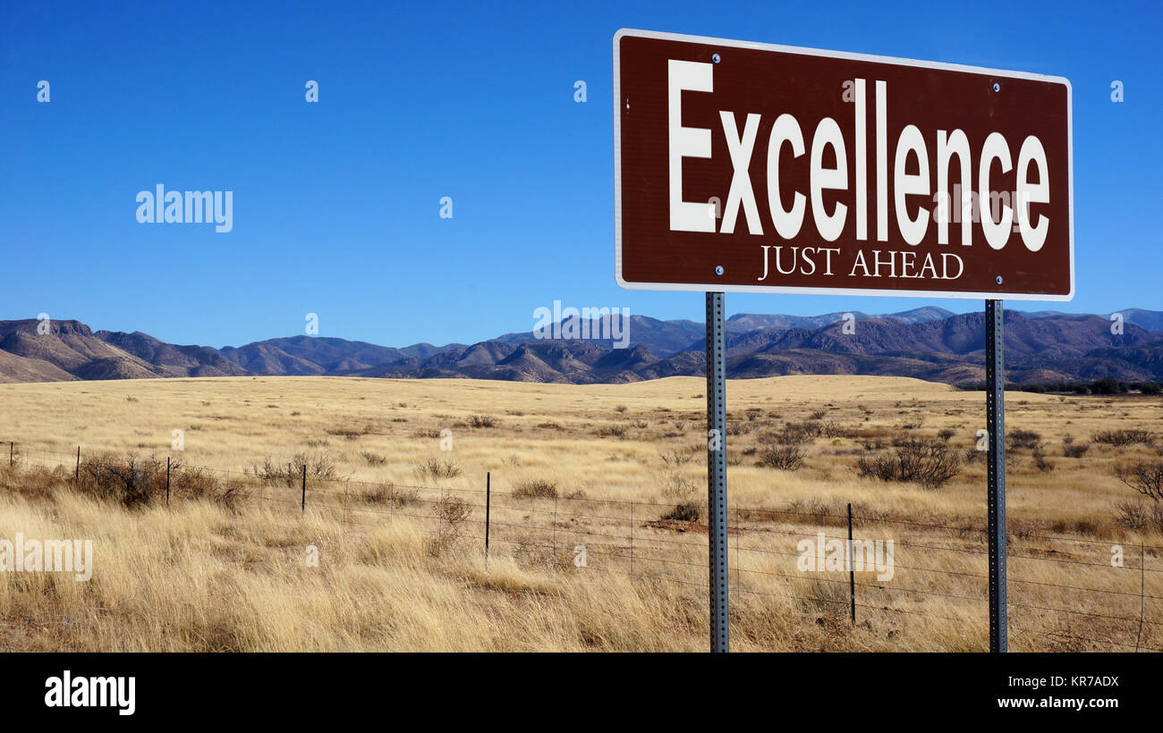 Excellence Just Ahead brown road sign Stock Photo - Alamy