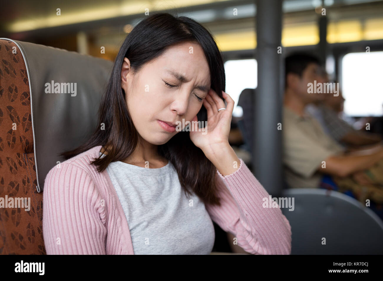 Woman suffer from headache inside the ferry Stock Photo - Alamy