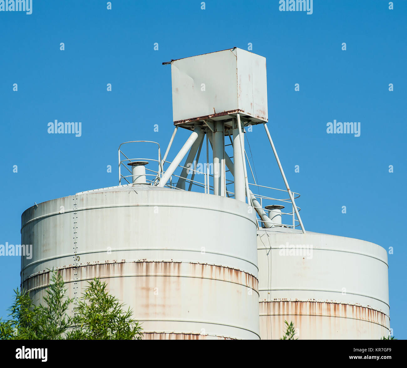 White silos for the storage of lime and cement Stock Photo - Alamy