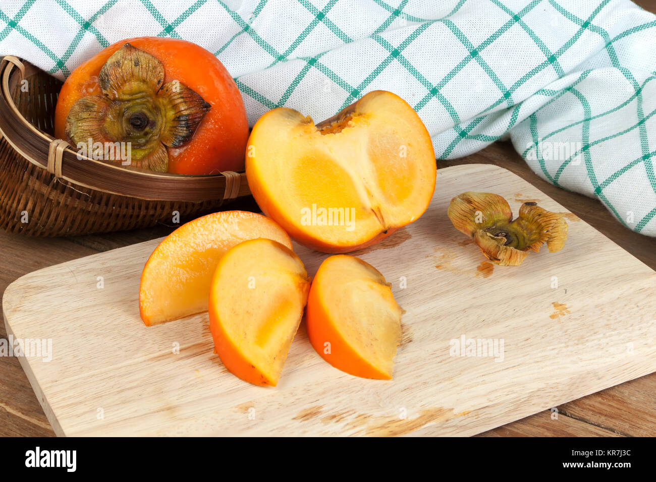 Persimmon yellow color fruits Stock Photo - Alamy
