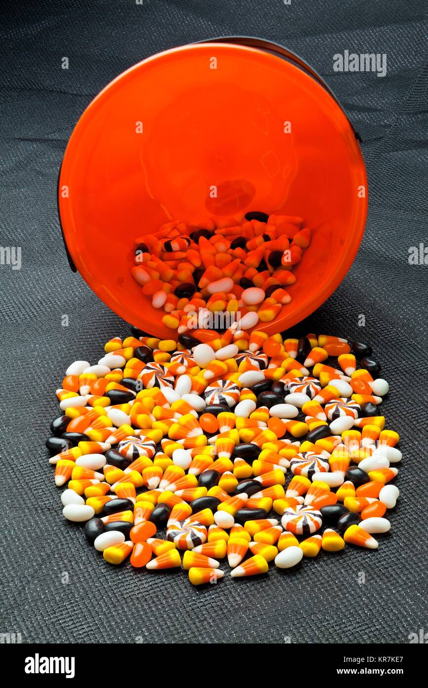 variety of candies spilled out of the bucket Stock Photo - Alamy