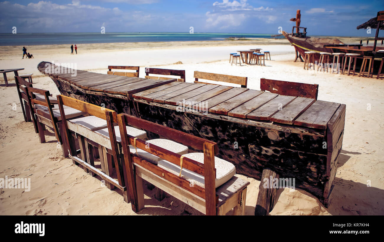Wooden table and chairs on the beach. Furniture for lounging on Stock ...
