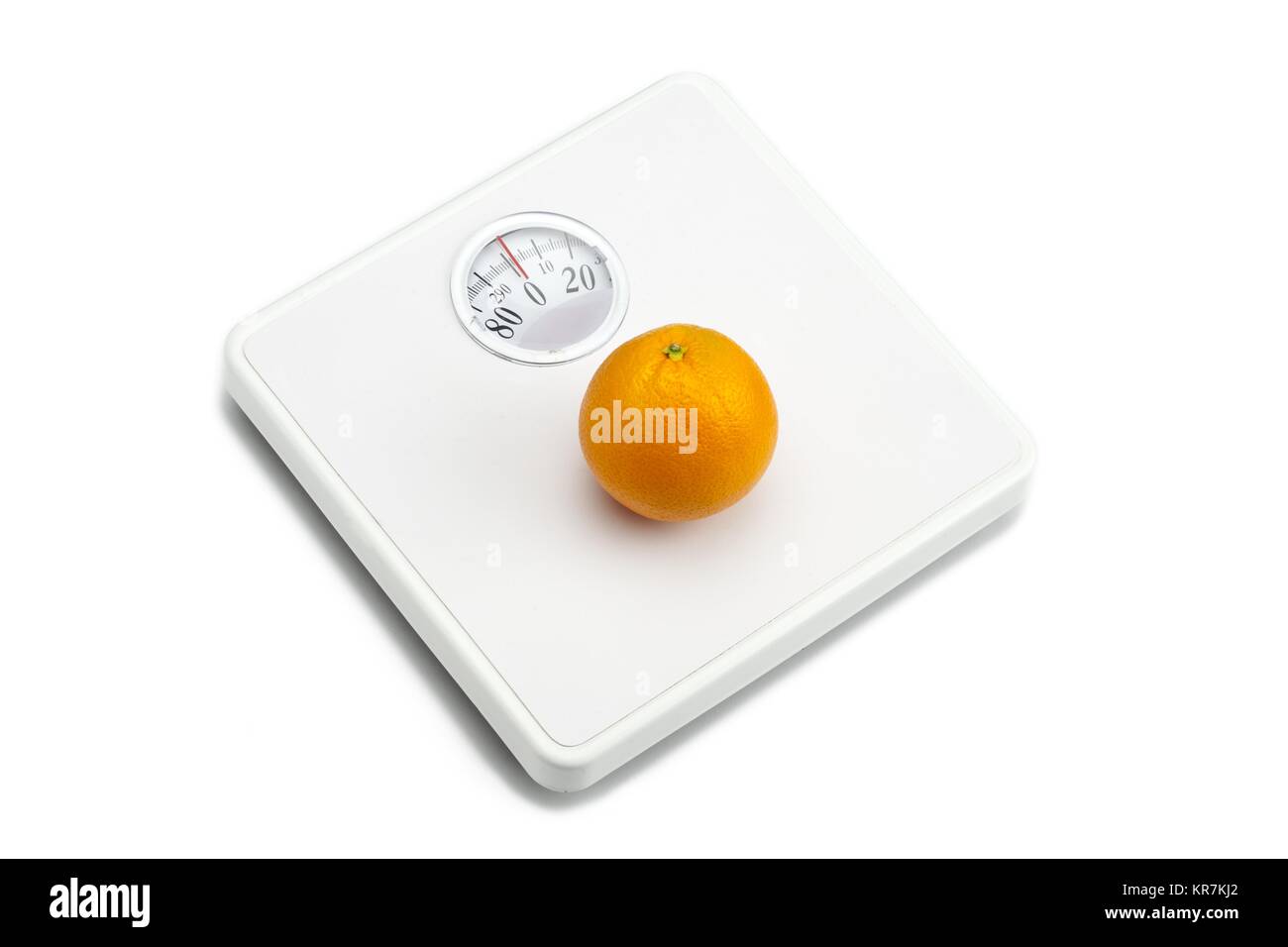 weighing scale and orange Stock Photo - Alamy