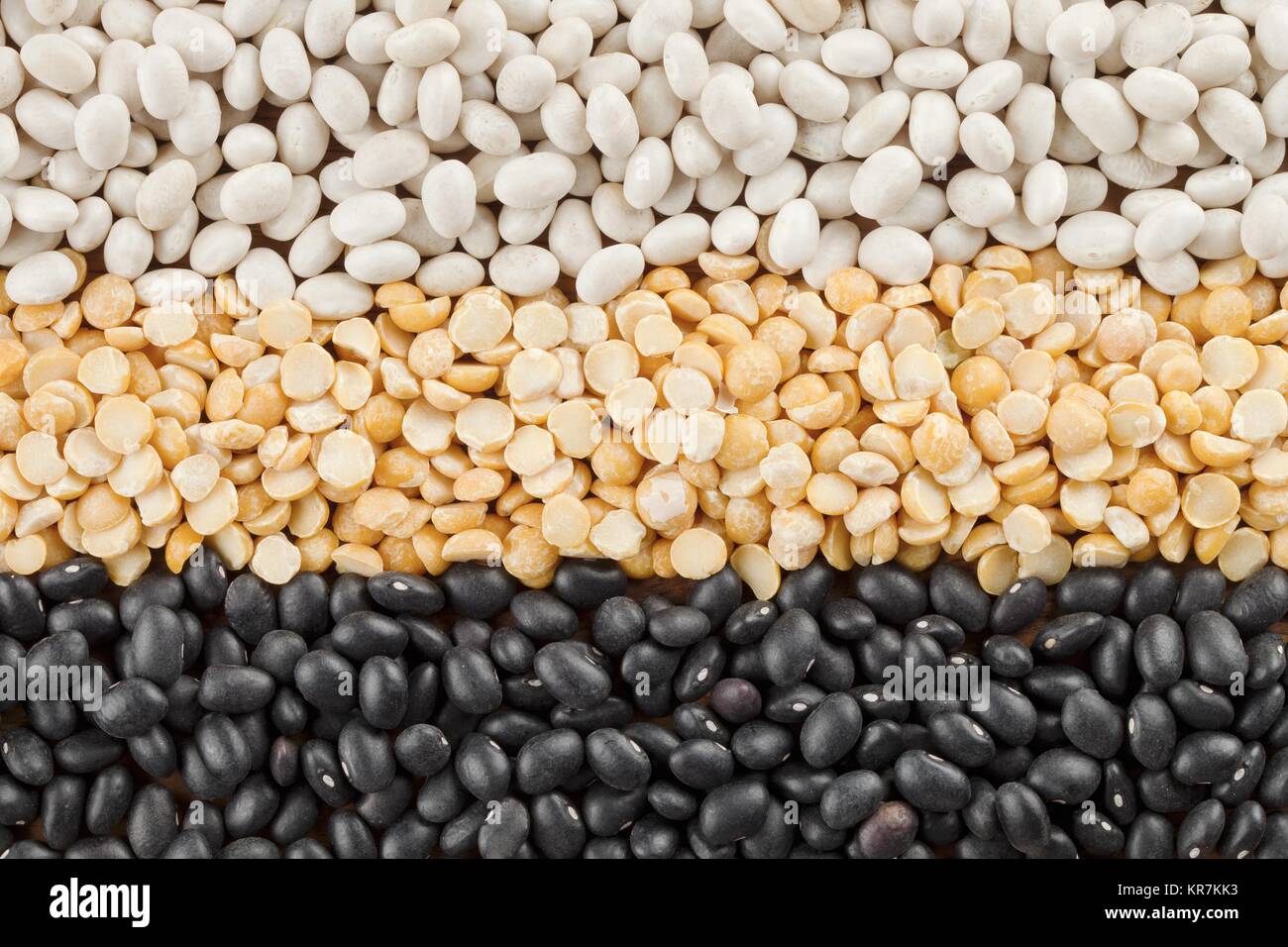 white and black beans with yellow split peas Stock Photo - Alamy