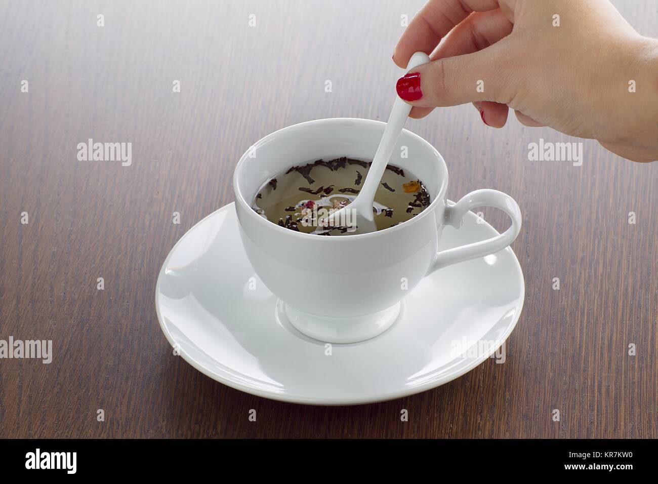 woman stirring lemon tea Stock Photo - Alamy