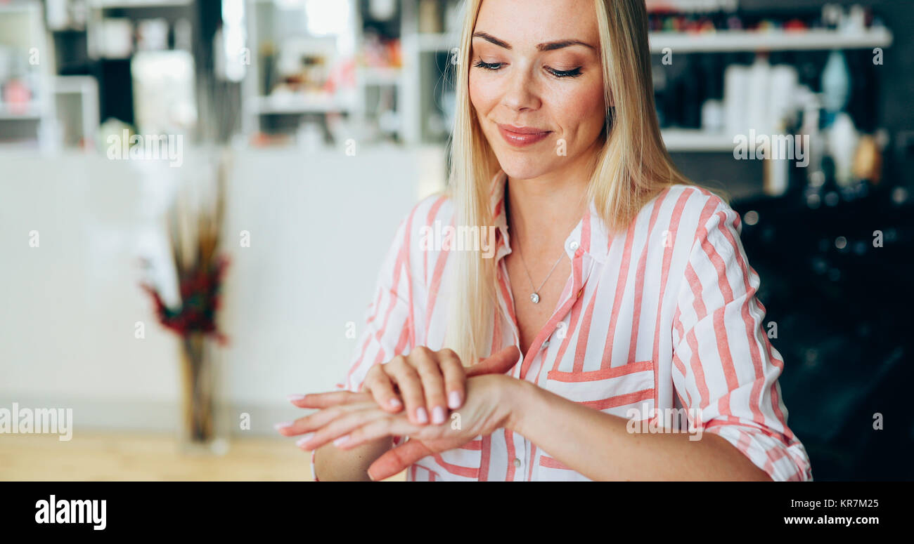 Woman applying creme to body hi-res stock photography and images - Alamy