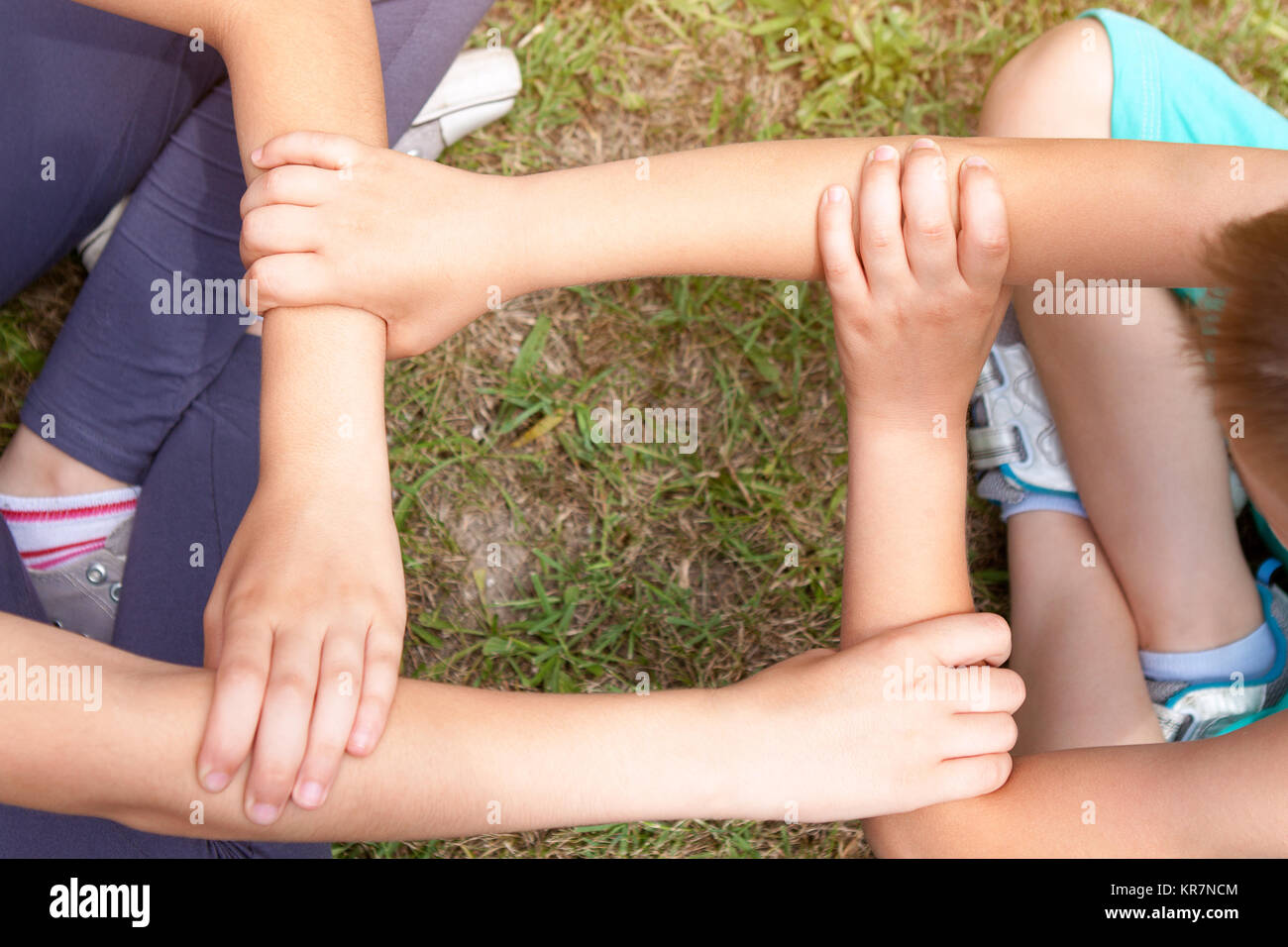 Teamwork- young children hands background Stock Photo - Alamy