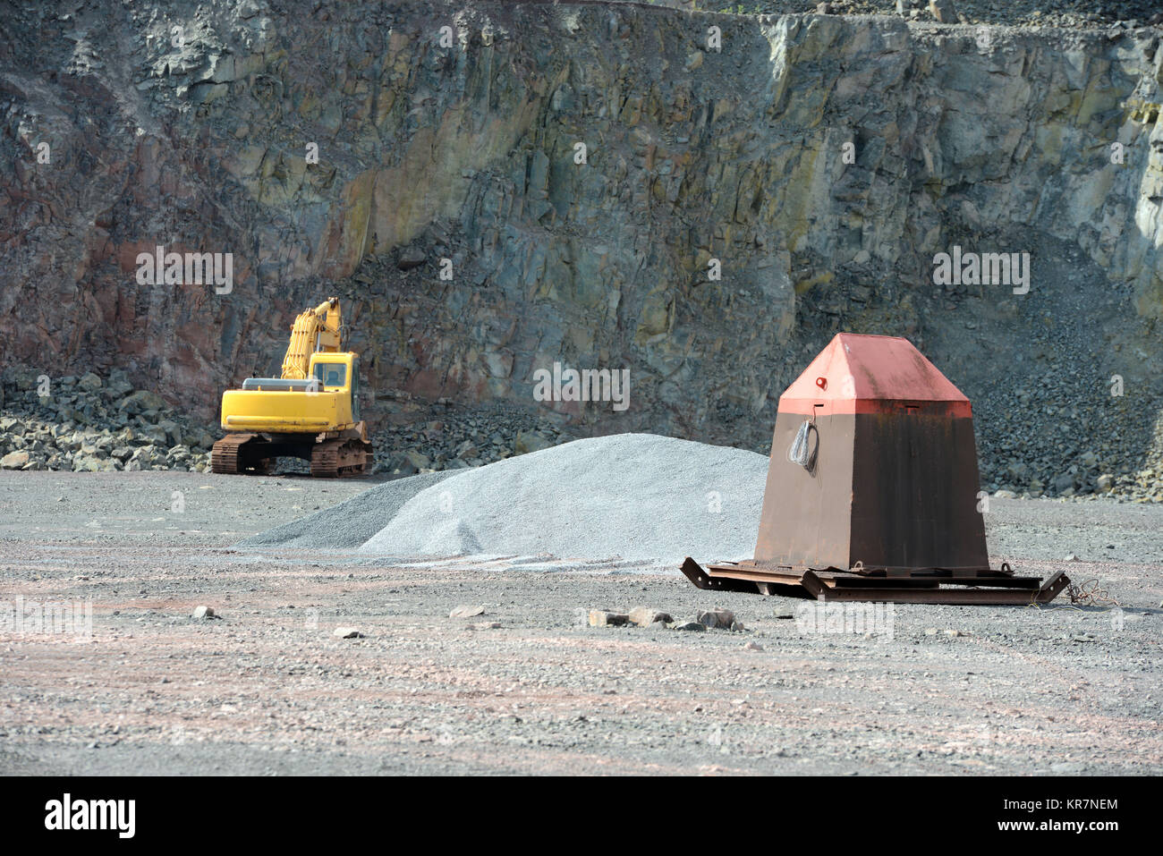 Earthmover in an active quarry mine of porphyry rocks. digging Stock ...