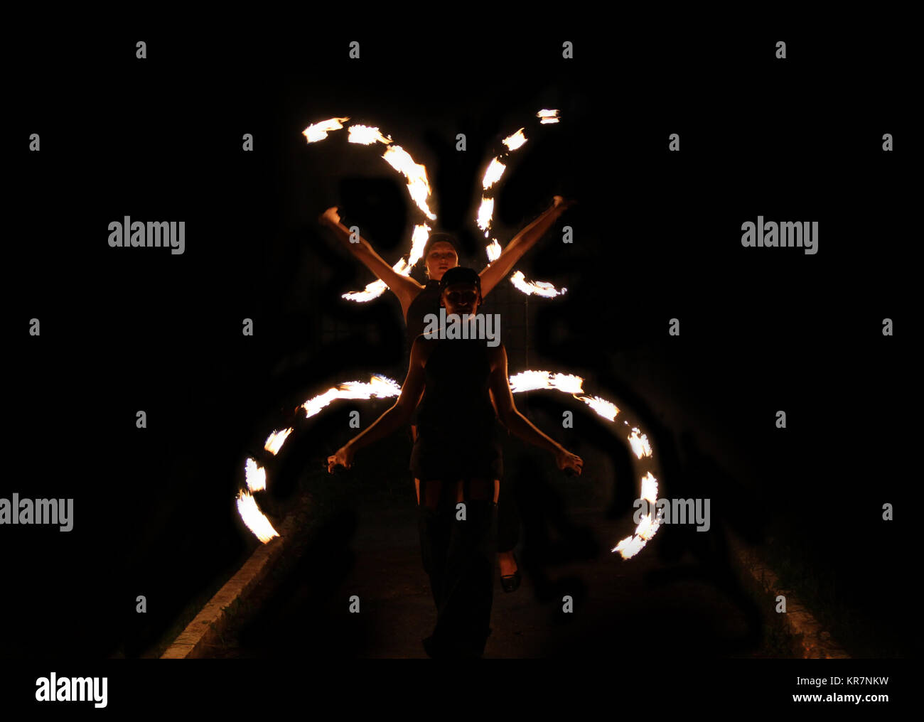 Beautiful dance with fire at night Stock Photo - Alamy