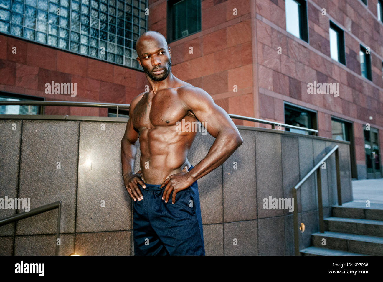 Black man resting in city Stock Photo - Alamy