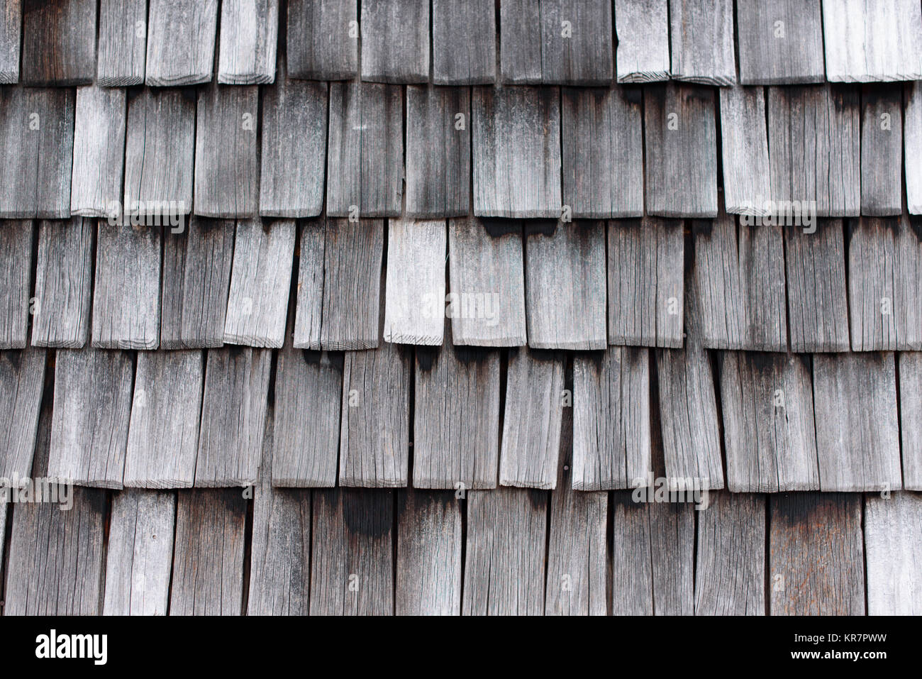 wooden tiles, detail of the old weathered wooden roof, wooden texture ...