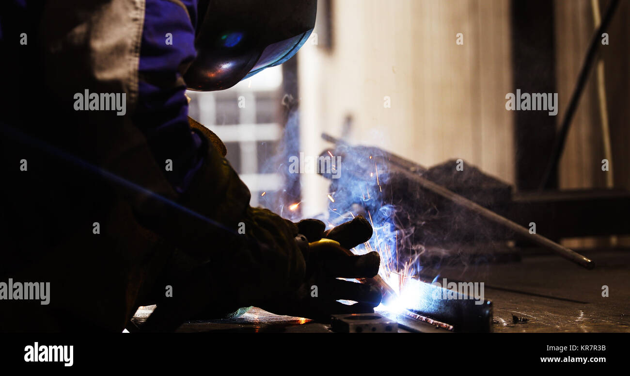 Metal worker welding in metal industry factory Stock Photo - Alamy