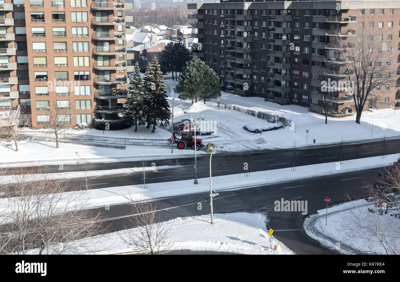 Modern condo buildings with huge windows and balconies and the snow ...