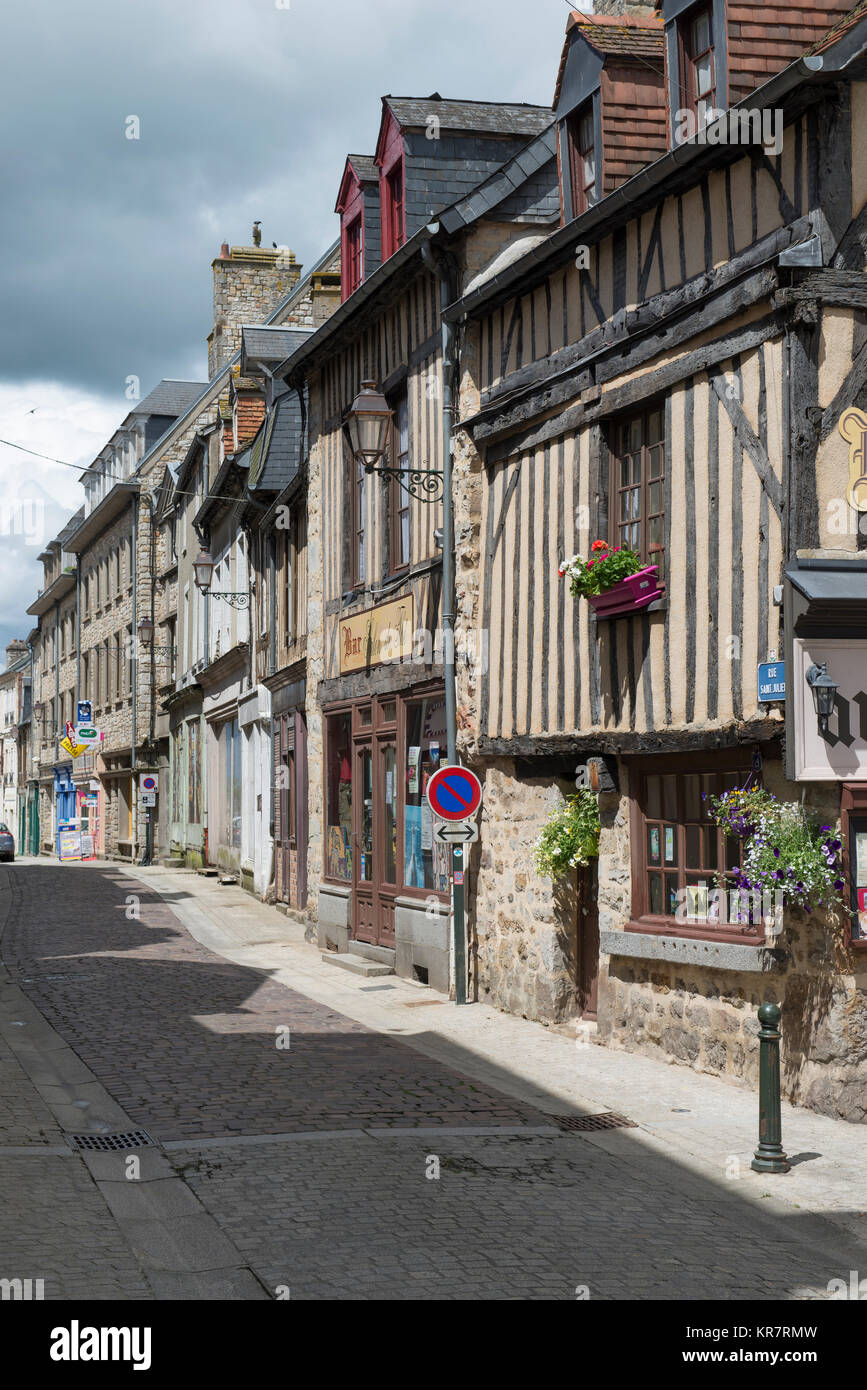 Old buildings in the medieval centre of Domfront in the Orne region of ...