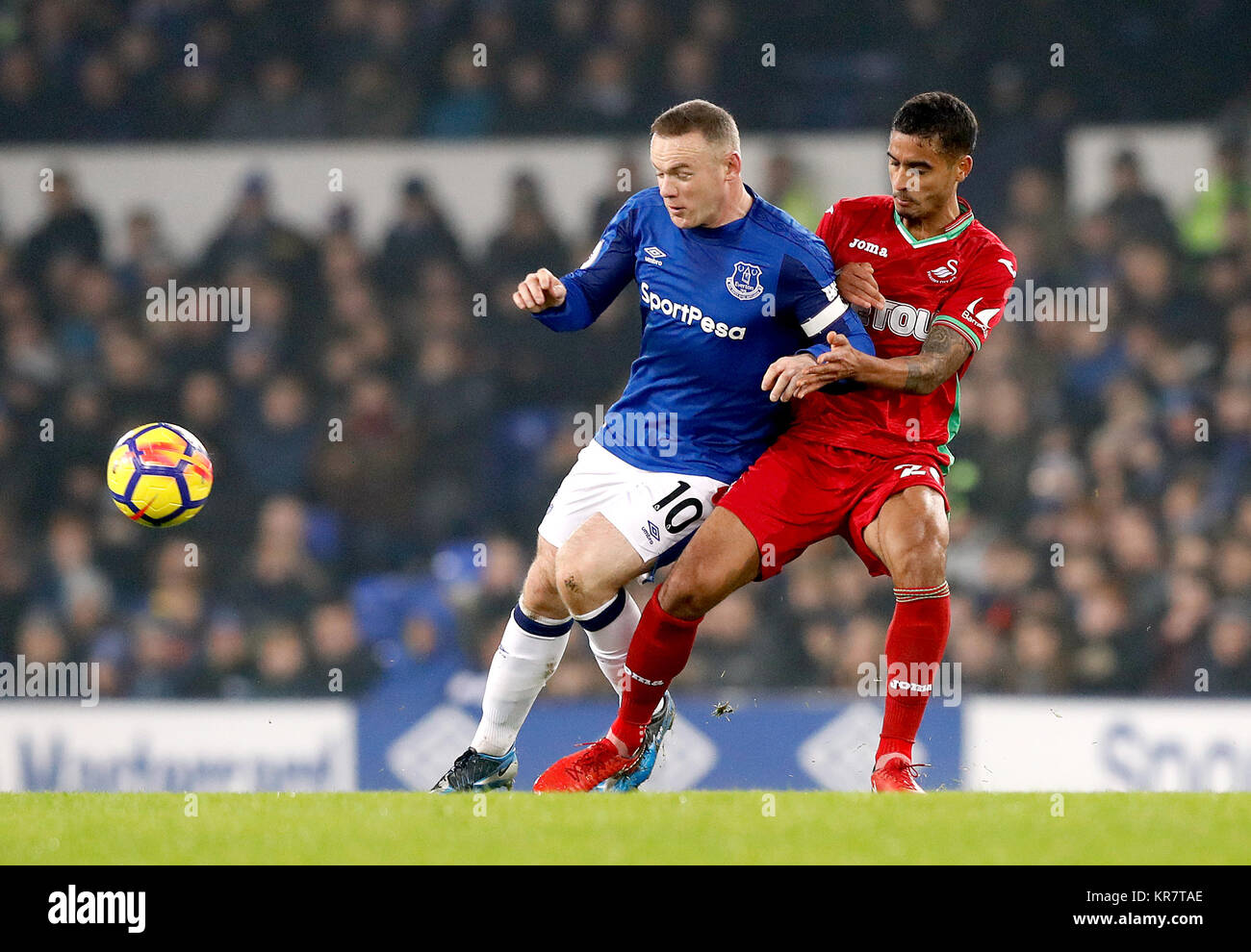 Everton's Wayne Rooney (left) and Swansea City's Kyle Naughton (right ...