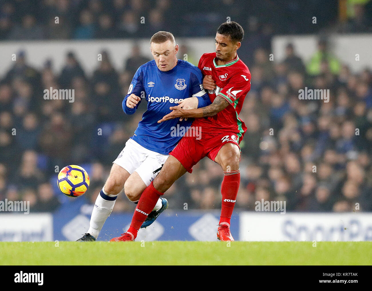Everton's Wayne Rooney (left) and Swansea City's Kyle Naughton (right ...