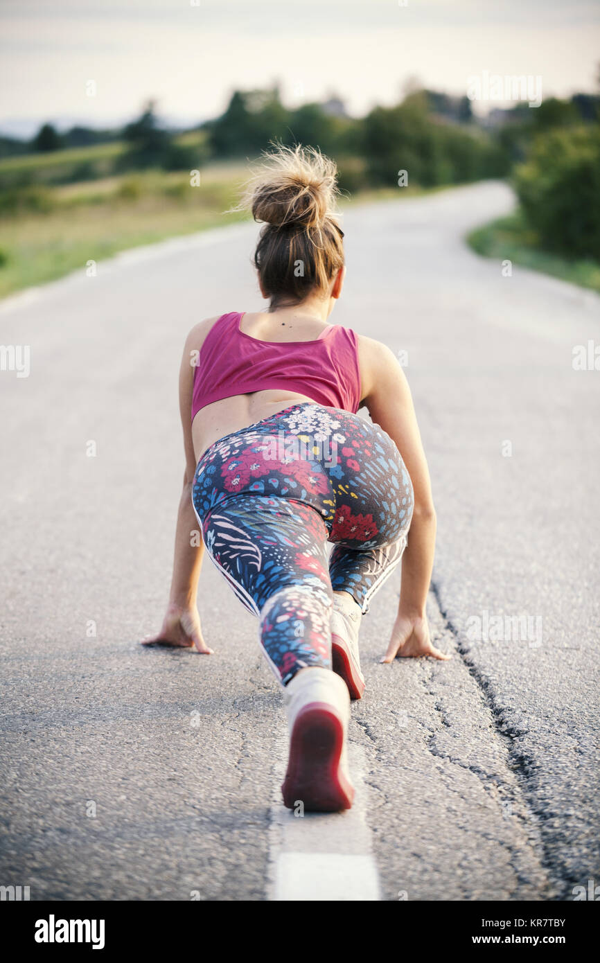 young beautiful woman exercise in nature Stock Photo - Alamy