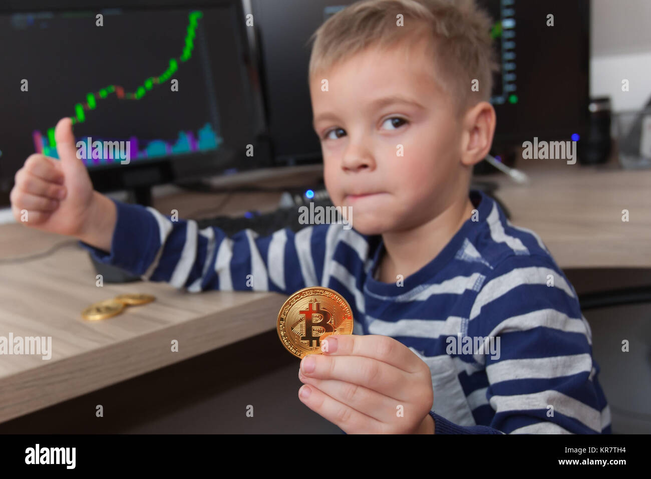 Boy holding gold coin hi-res stock photography and images - Alamy