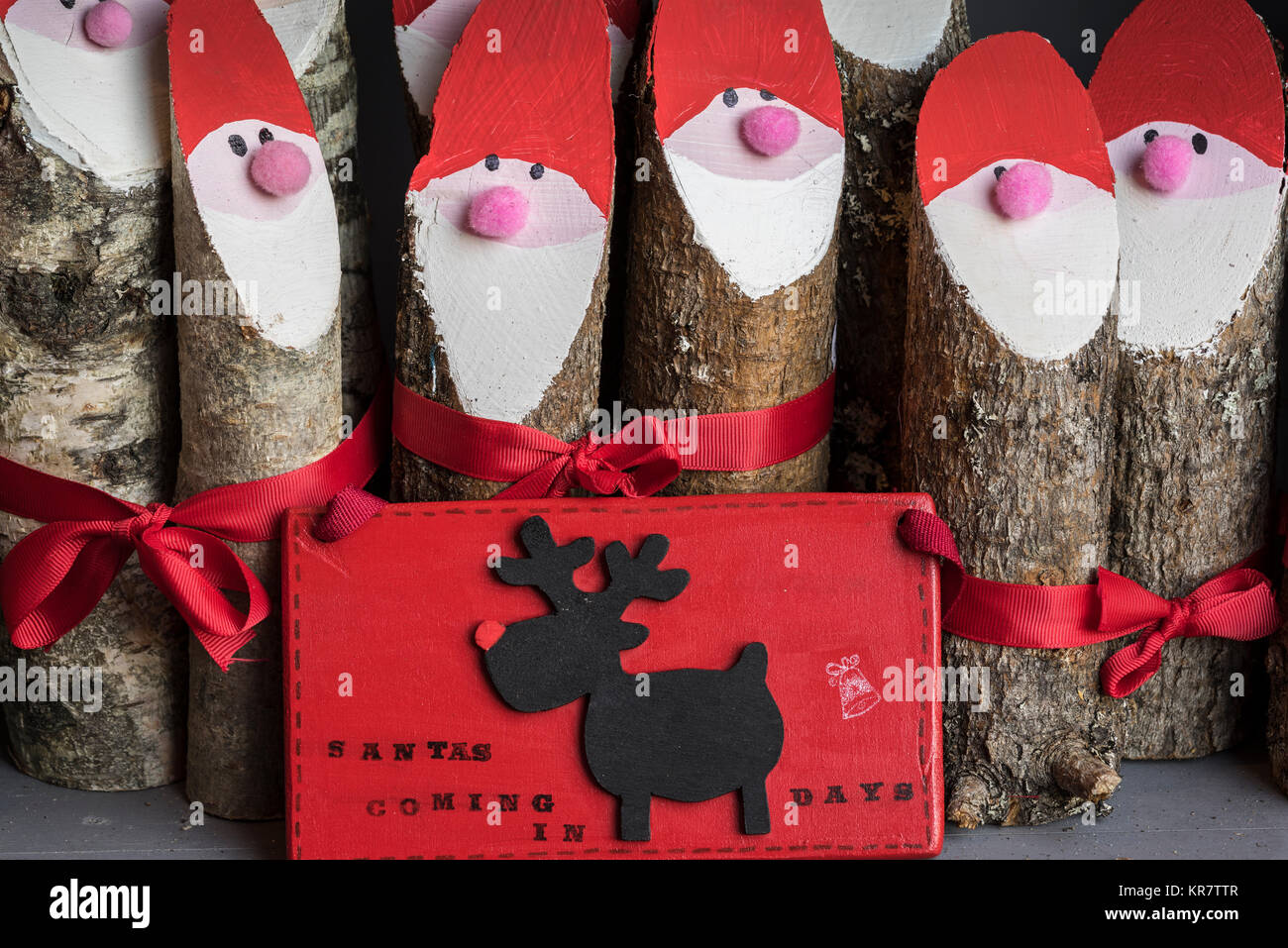Festive Christmas hand made log Santas Stock Photo - Alamy