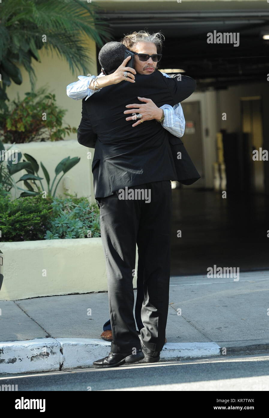 Steven Tyler kisses his driver and takes a selfie with a fan outside Le ...