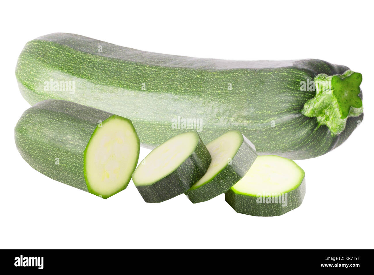 Isolated zucchini. One courgette and slices isolated on white ...