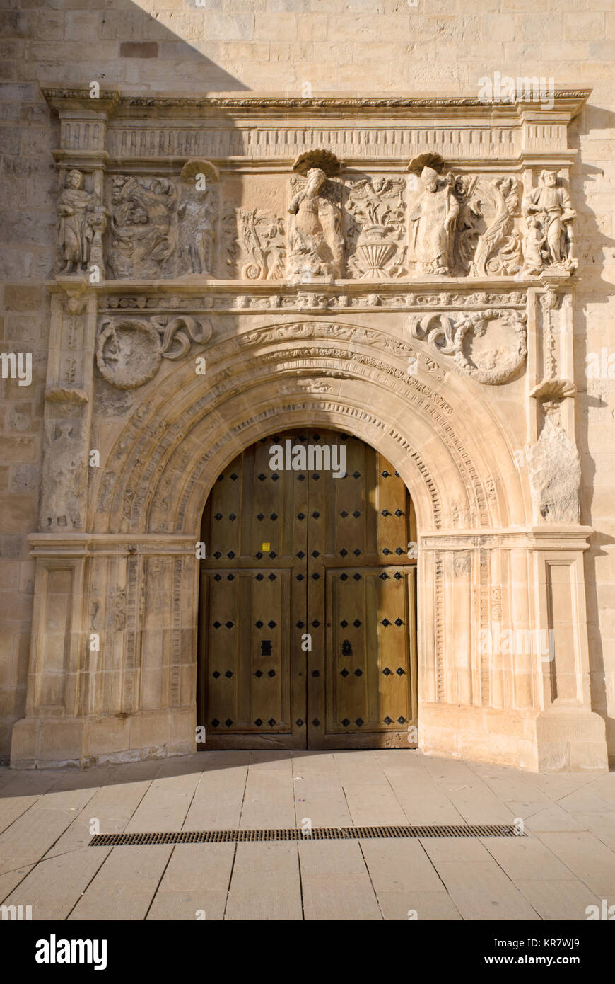Church door and facade in the ancient village Briviesca, in Burgos ...