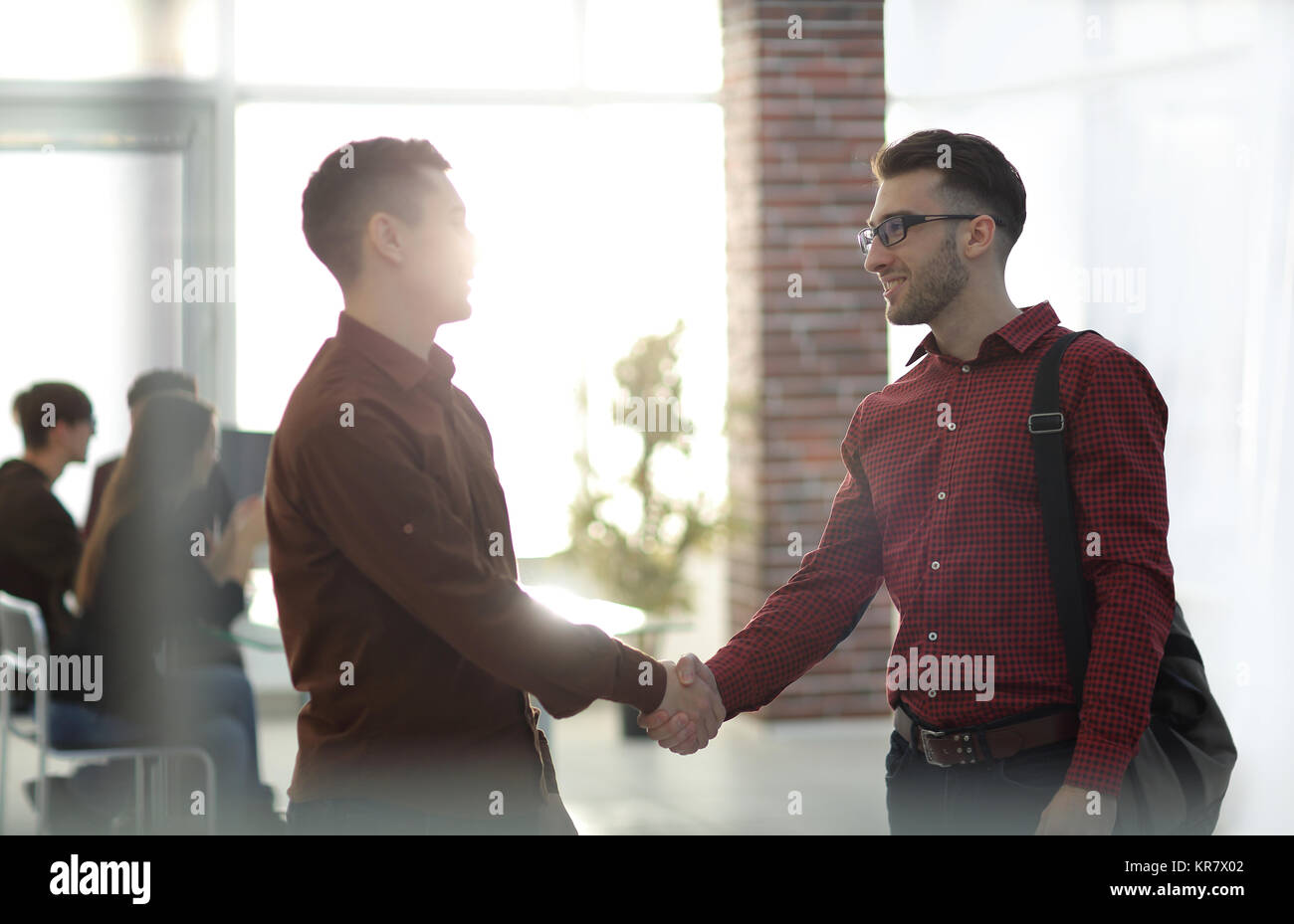 handshake colleagues in the office Stock Photo - Alamy