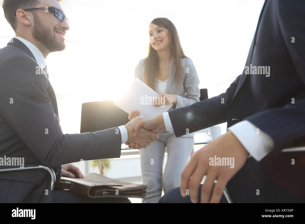 business handshake in an office Stock Photo - Alamy
