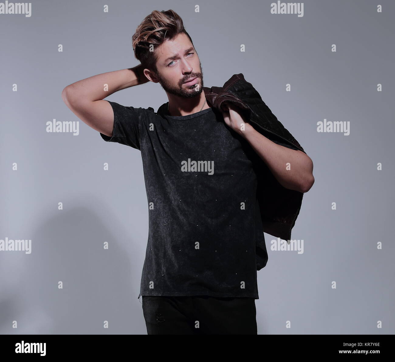 Portrait of a pensive handsome man over gray background Stock Photo - Alamy