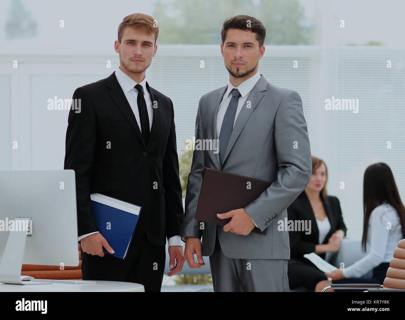 Two successful business people looking confident Stock Photo - Alamy