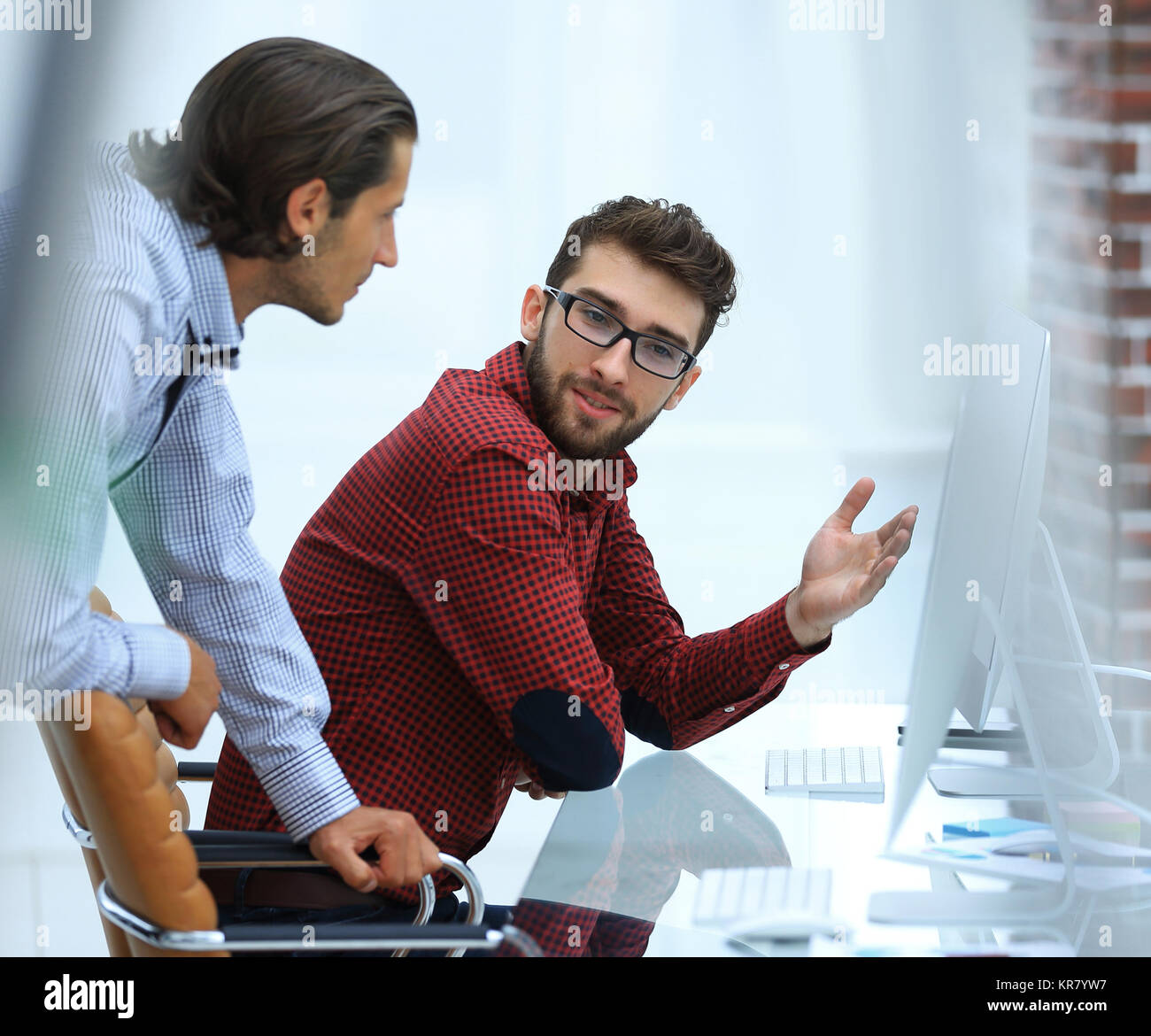 two office employee talking in the office Stock Photo - Alamy