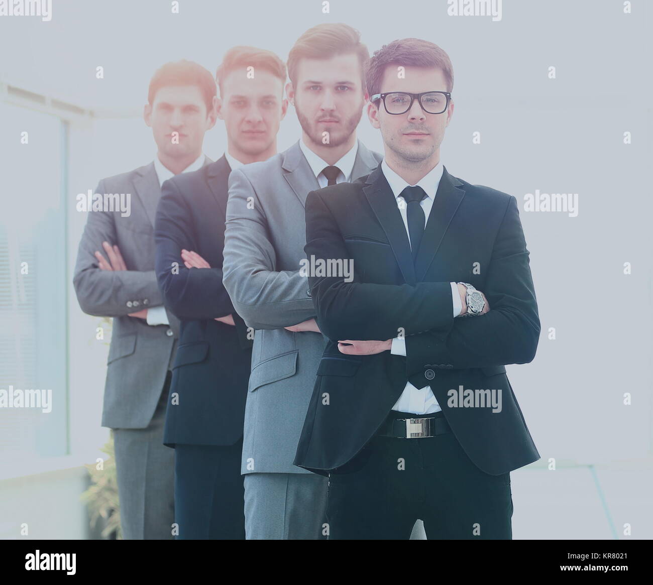 Business team in a line smiling at the camera Stock Photo - Alamy