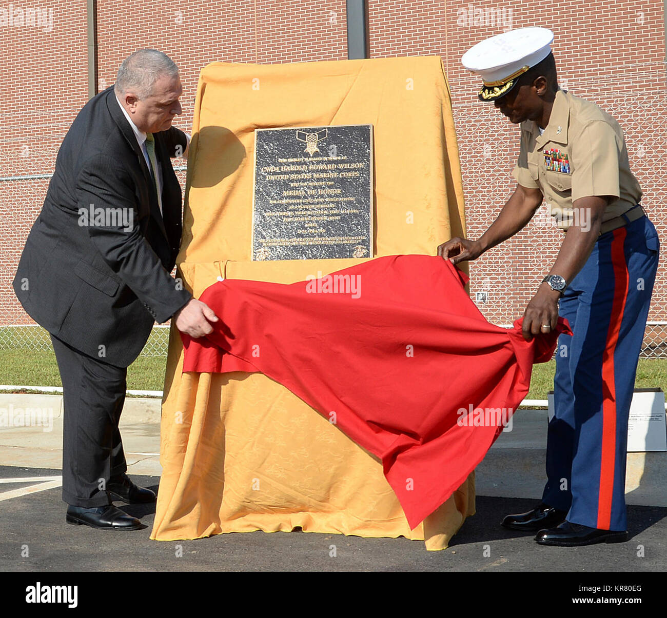 John M. Wilson, left, son of Medal of Honor recipient Chief Warrant ...