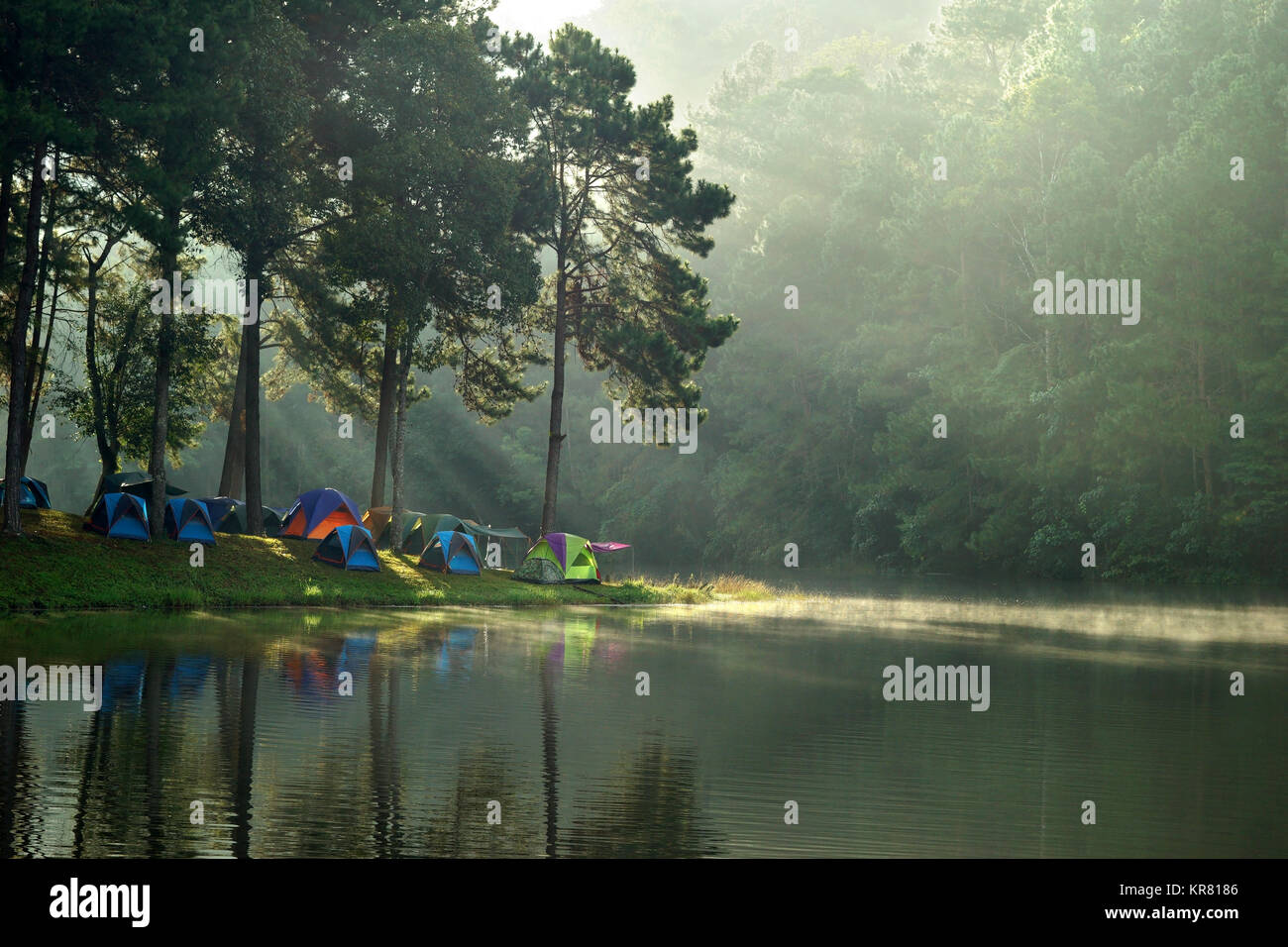 beautiful landscape, camping tents at outdoor camp site near the lake ...