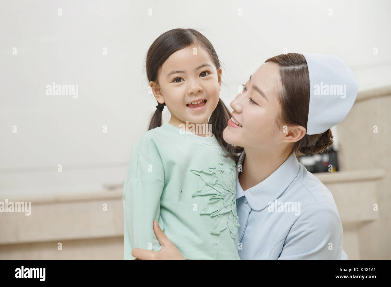Health care workers and girls Stock Photo - Alamy