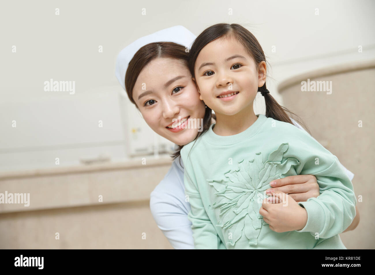 Health care workers and girls Stock Photo - Alamy