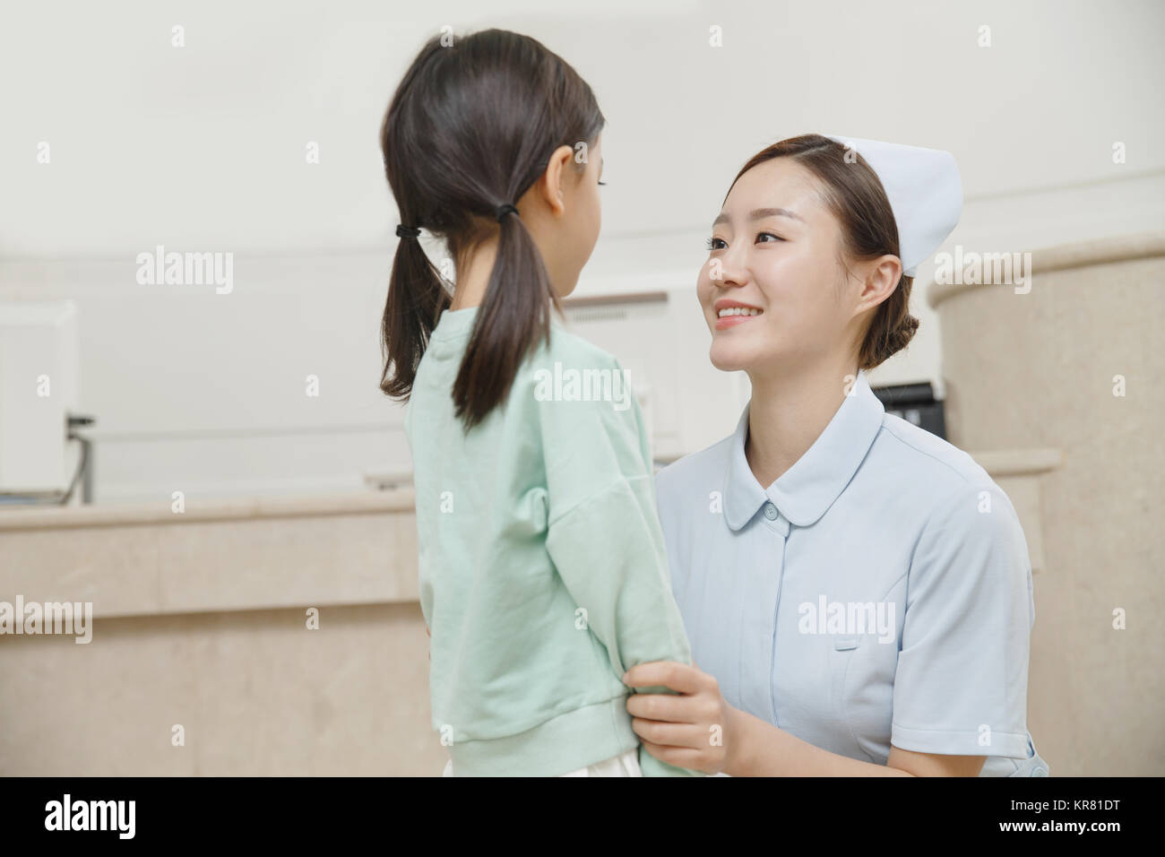 Health care workers and girls Stock Photo - Alamy