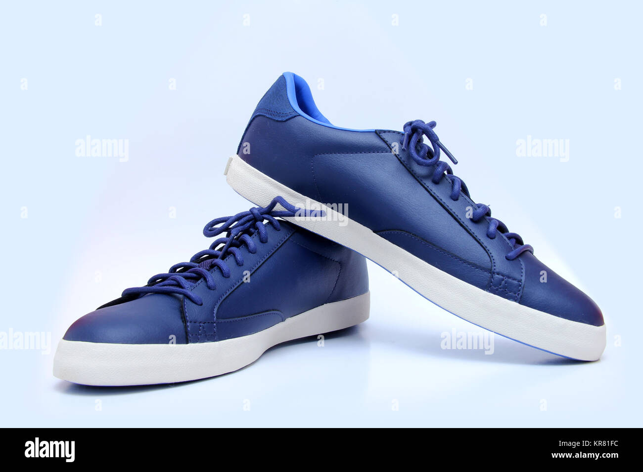 Pair of Blue and White Unisex Shoe - Sneakers Stock Photo - Alamy