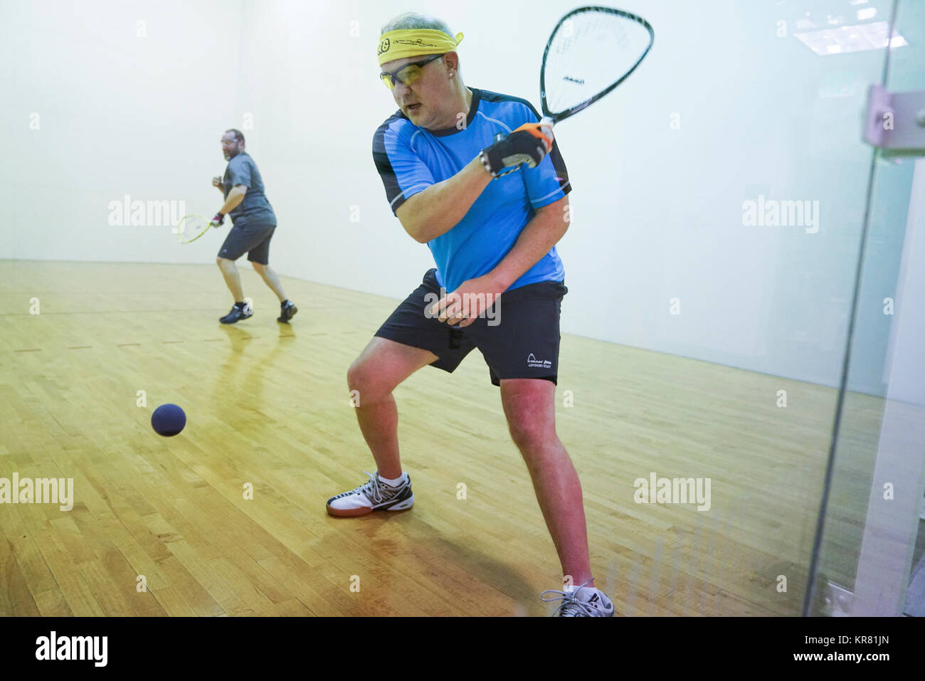 Billy Ray, 50th Contracting Squadron, returns a serve in a game against ...